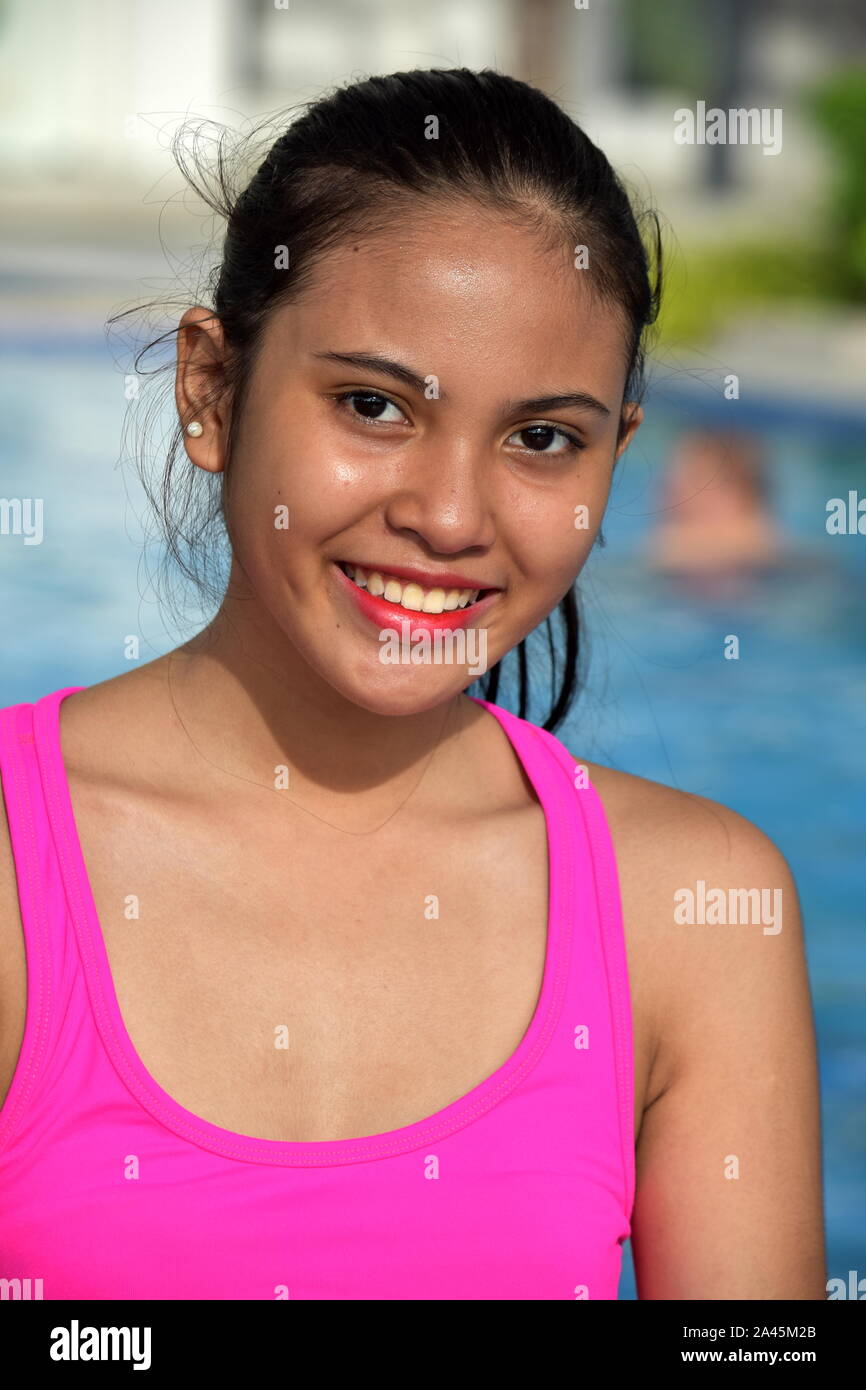 Filipina Female Smiling Sitting By Pool Stock Photo - Alamy