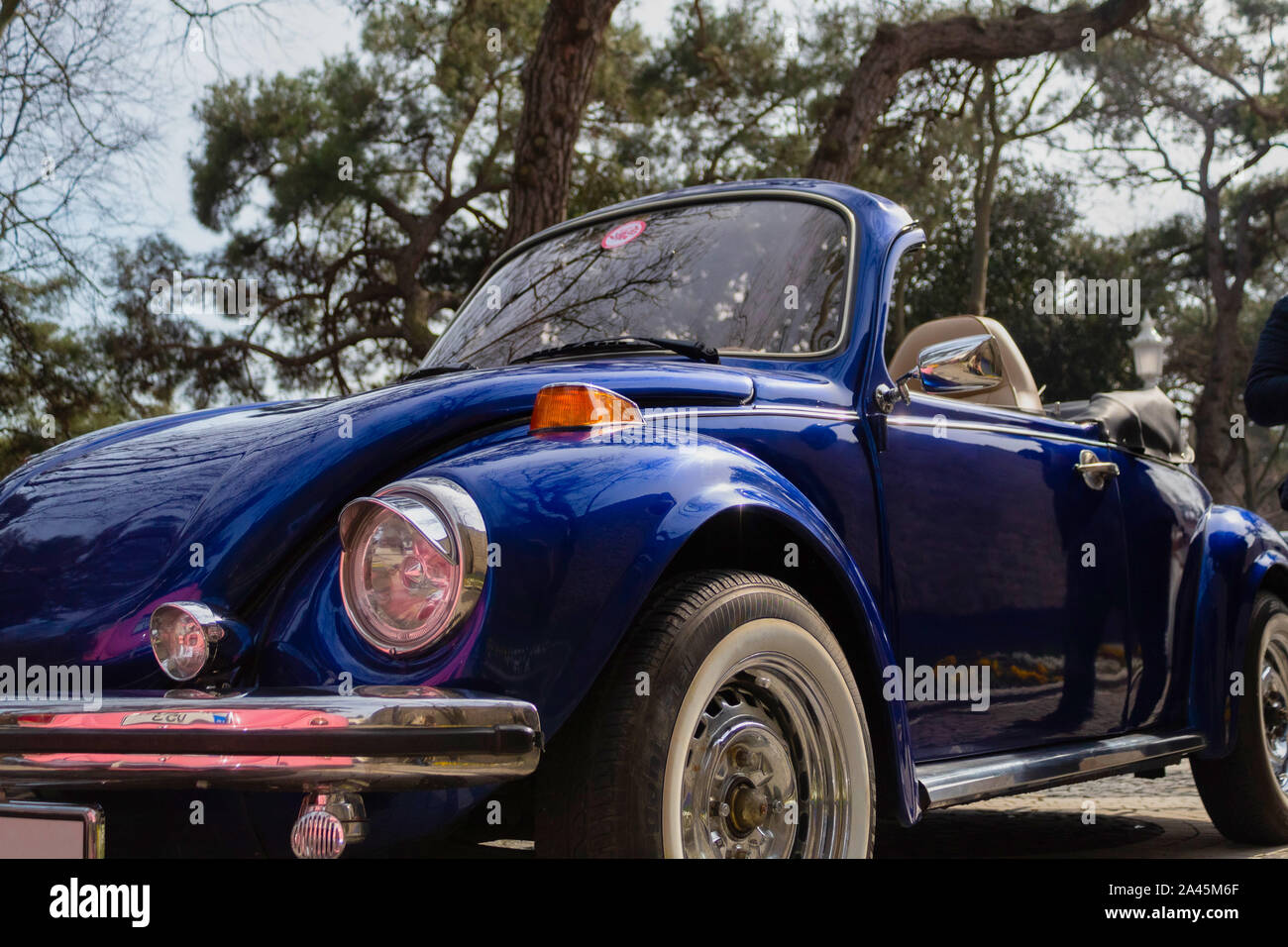 Front-left side view of navy blue classic convertible car Stock Photo ...