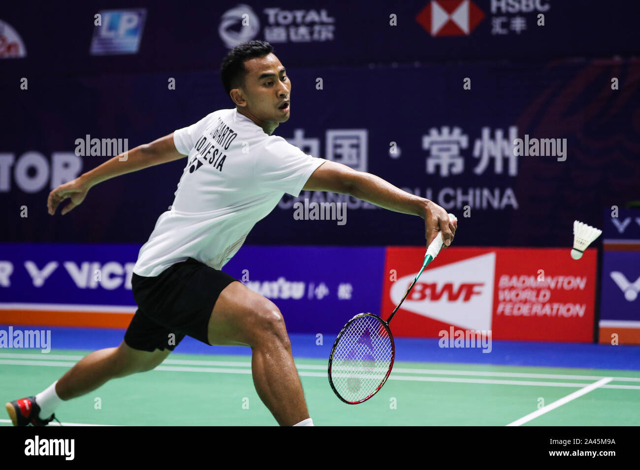 Hong Kong professional badminton player Wong Wing Ki competes against ...