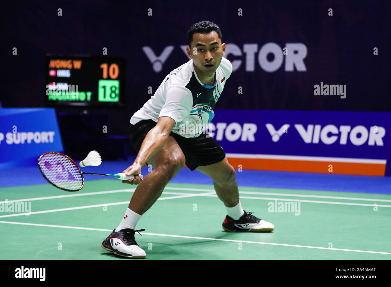 Hong Kong professional badminton player Wong Wing Ki competes against ...