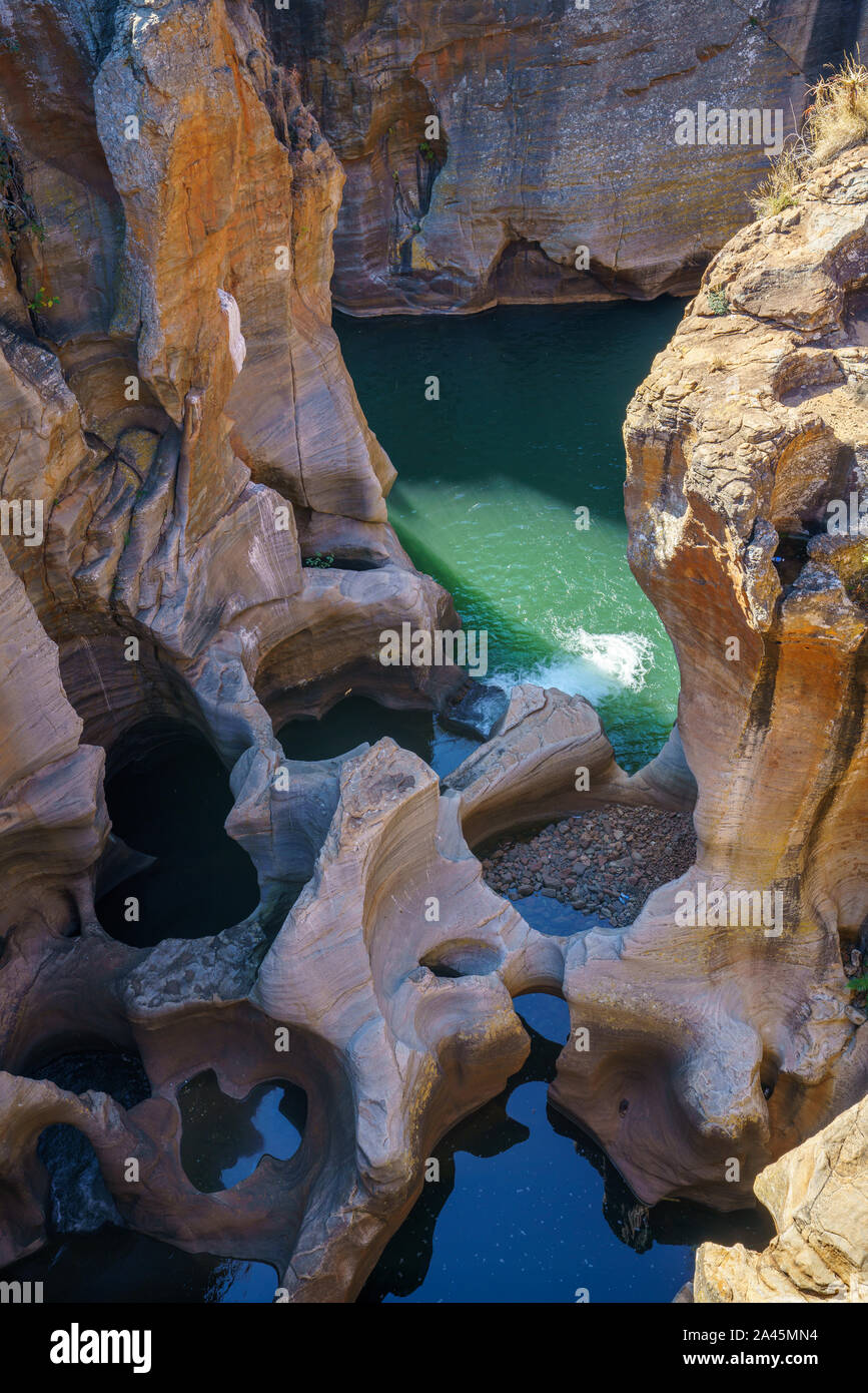 steep walls of red sandstone at bourkes luck potholes, mpumalanga ...