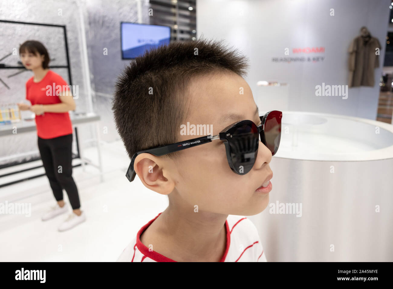 A child wears the Huawei x Gentle Monster smart glasses at a Huawei ...