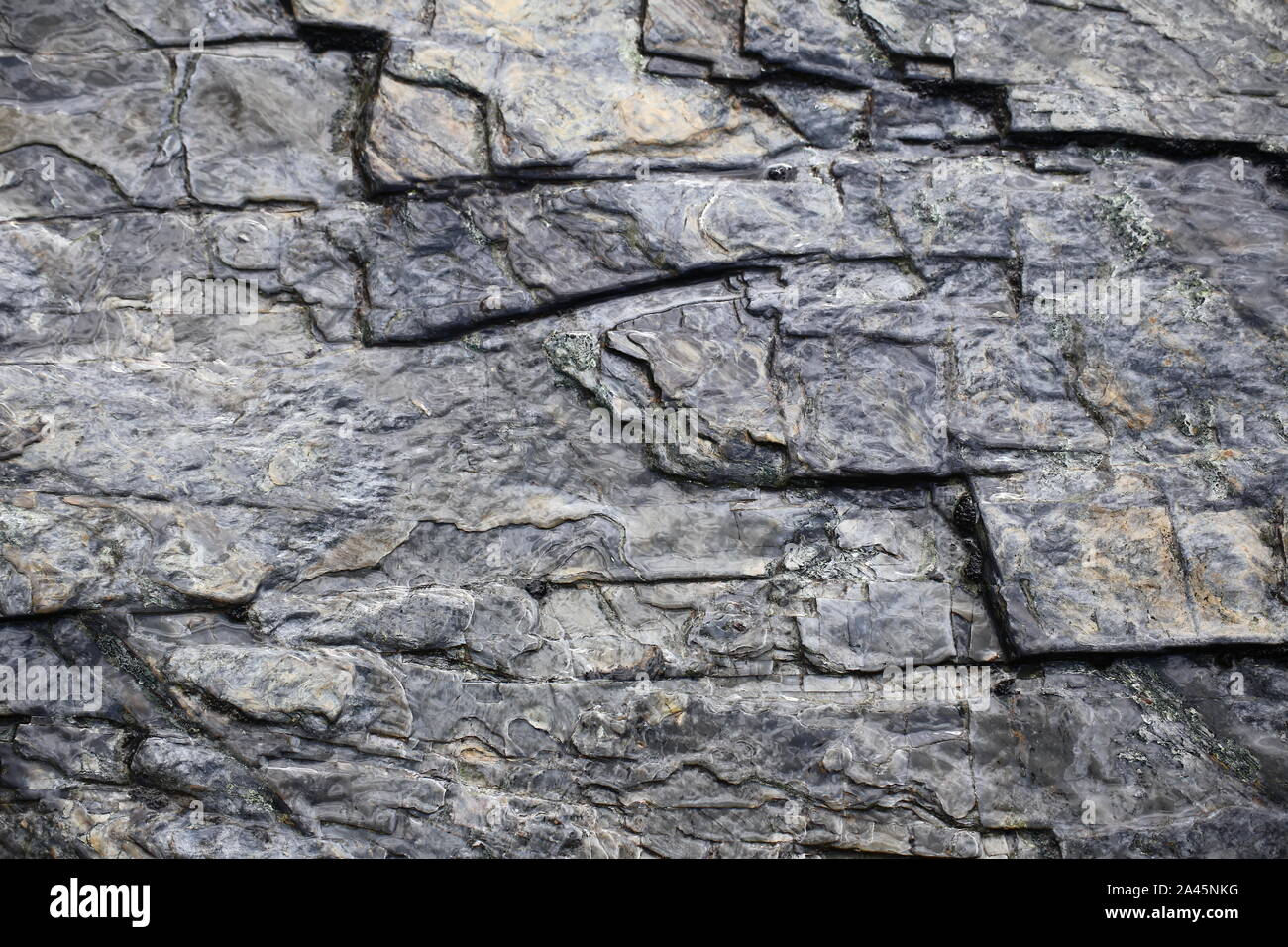 Slate surface with soft reflections of water Stock Photo - Alamy
