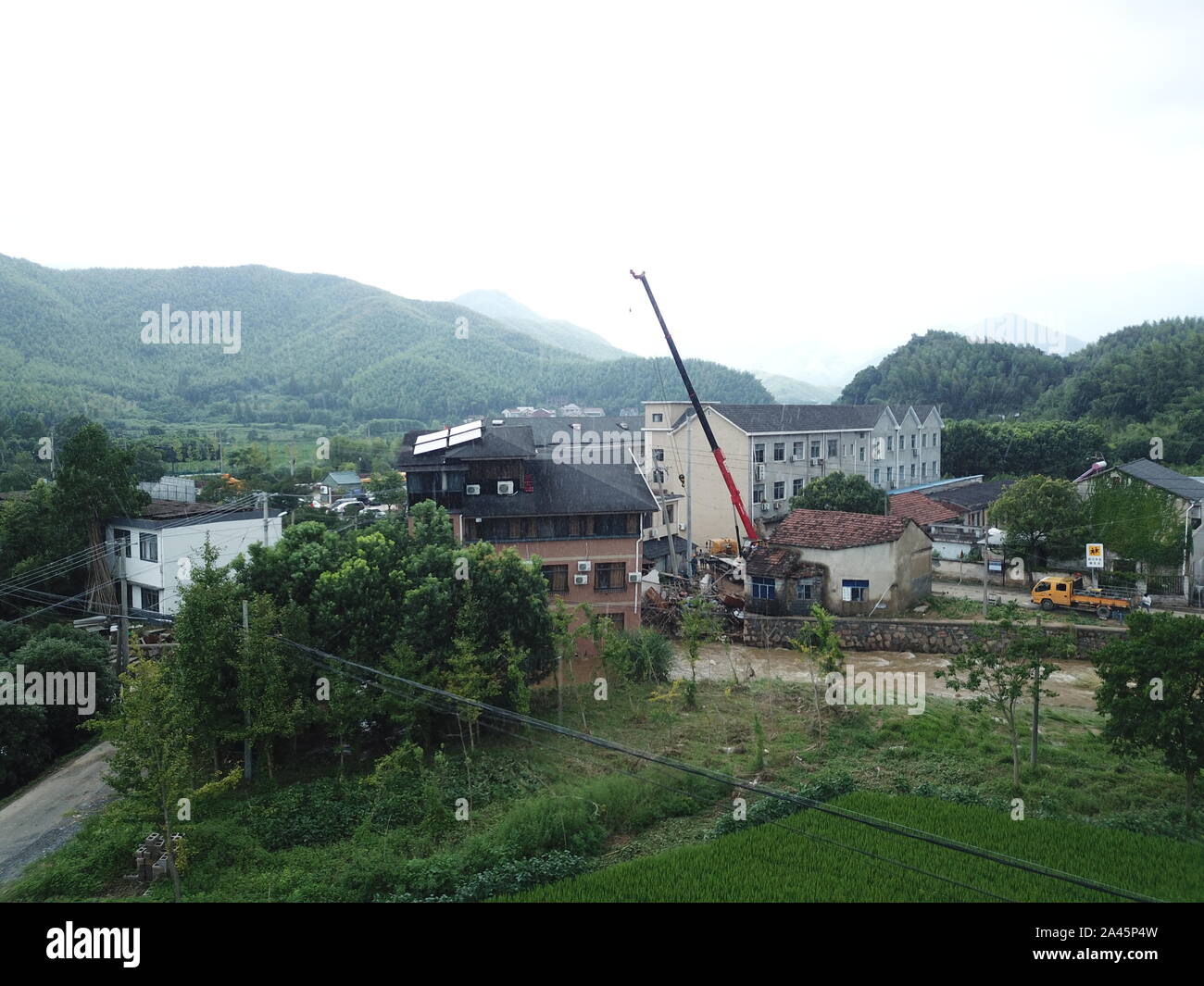A house tilts to the river due to heavy rainstorm caused by Typhoon ...