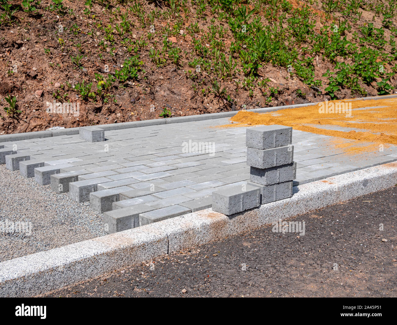 Footpath Paving work Road construction Stock Photo - Alamy