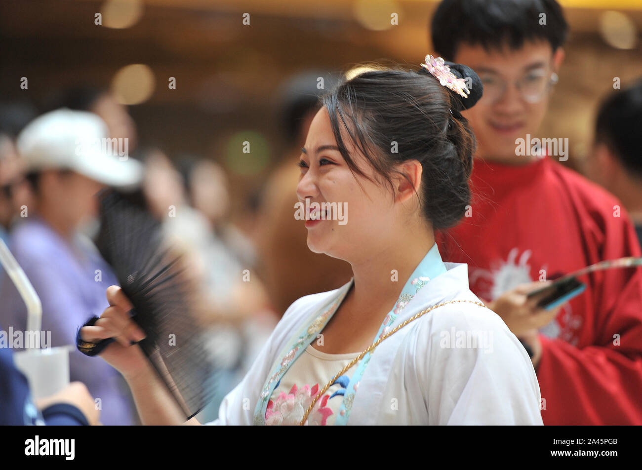 Beauties dressing in ancient Chinese clothes prepare to demonstrate and ...