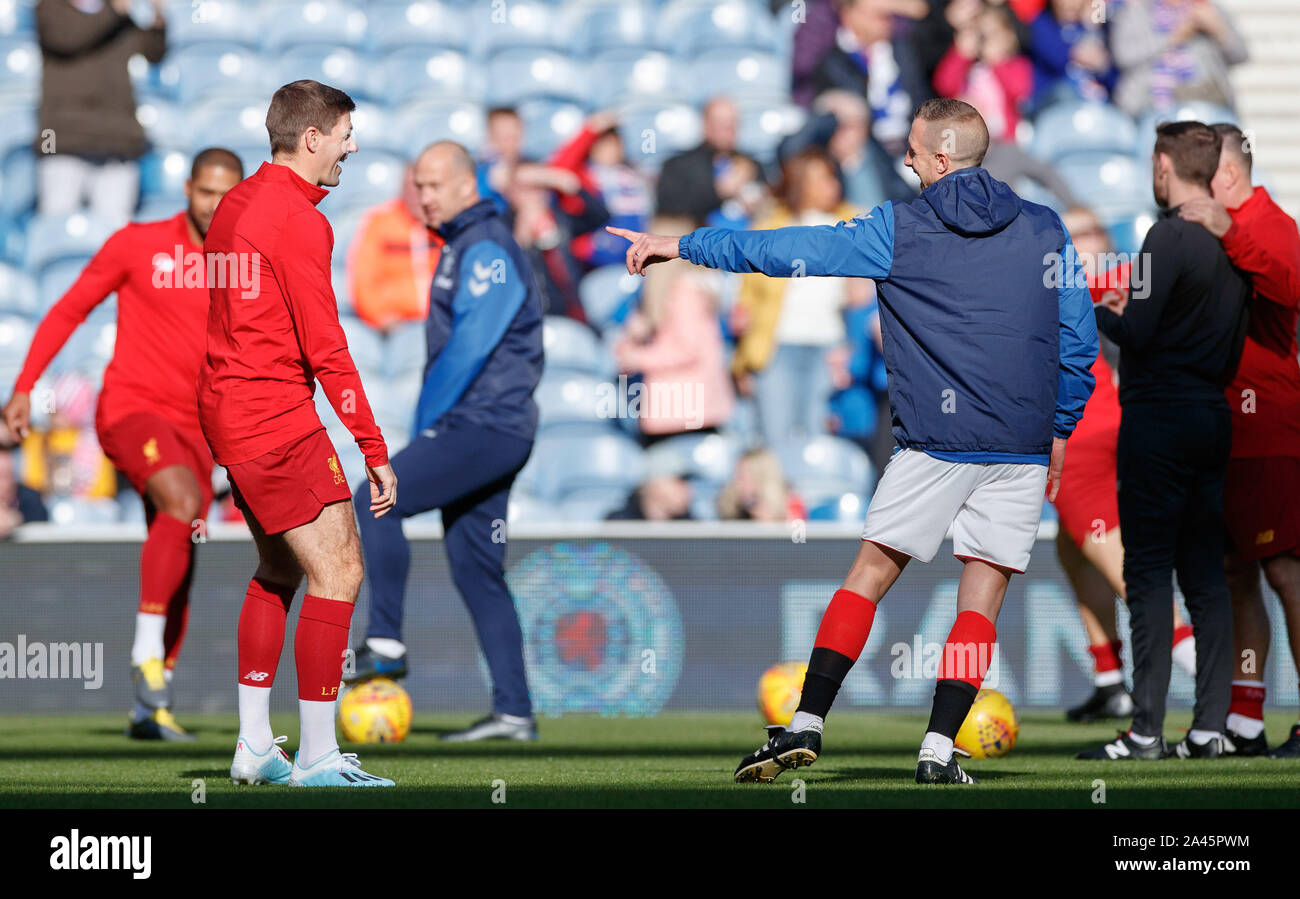 Steven Gerrard speaks to Gregory Vignal before the legends match at ...