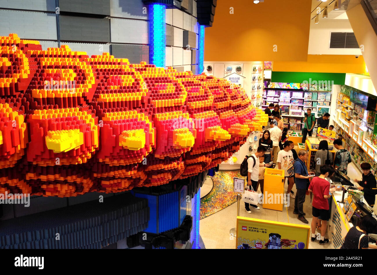 Consumers stroll and observe new LEGO models exhibited as the first ...