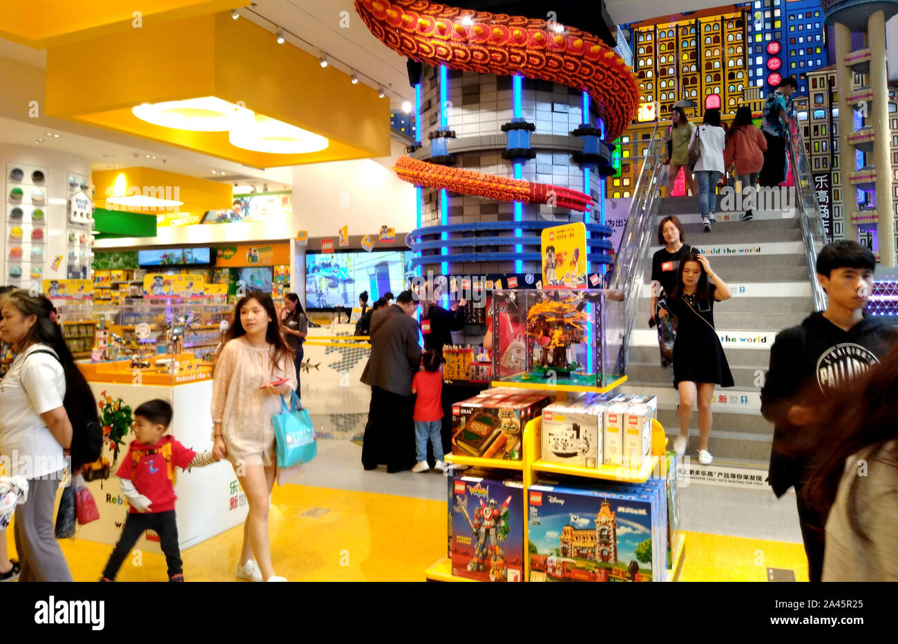 Consumers stroll and observe new LEGO models exhibited as the first ...
