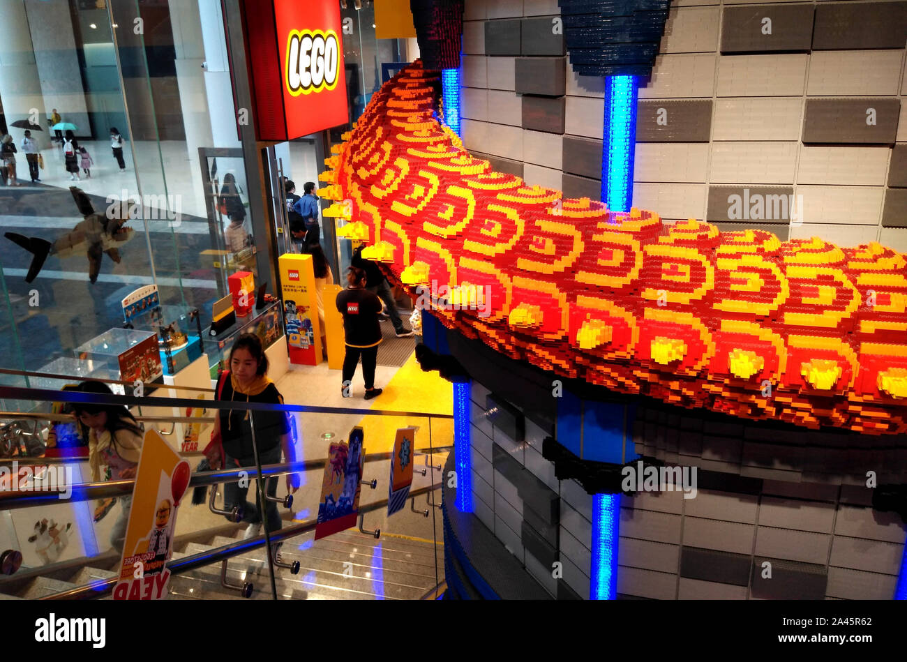 Consumers stroll and observe new LEGO models exhibited as the first ...