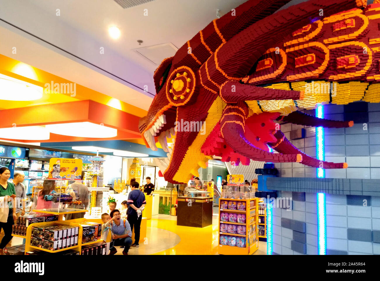 Consumers stroll and observe new LEGO models exhibited as the first ...