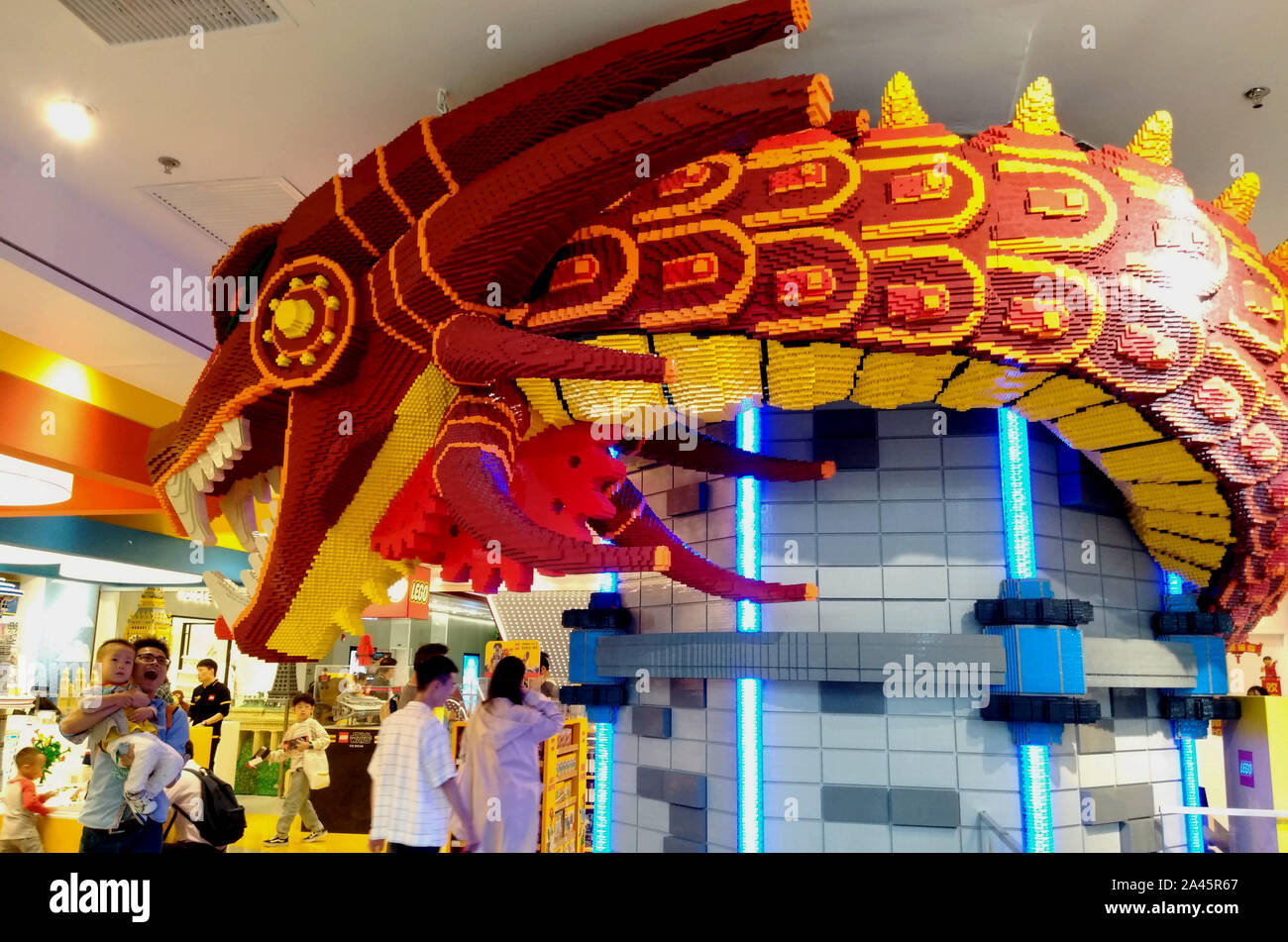 Consumers stroll and observe new LEGO models exhibited as the first ...