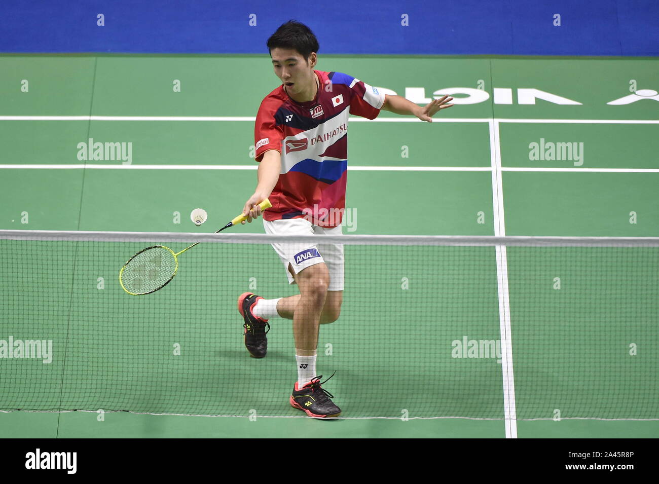 Japanese professional badminton player Kanta Tsuneyama competes against ...