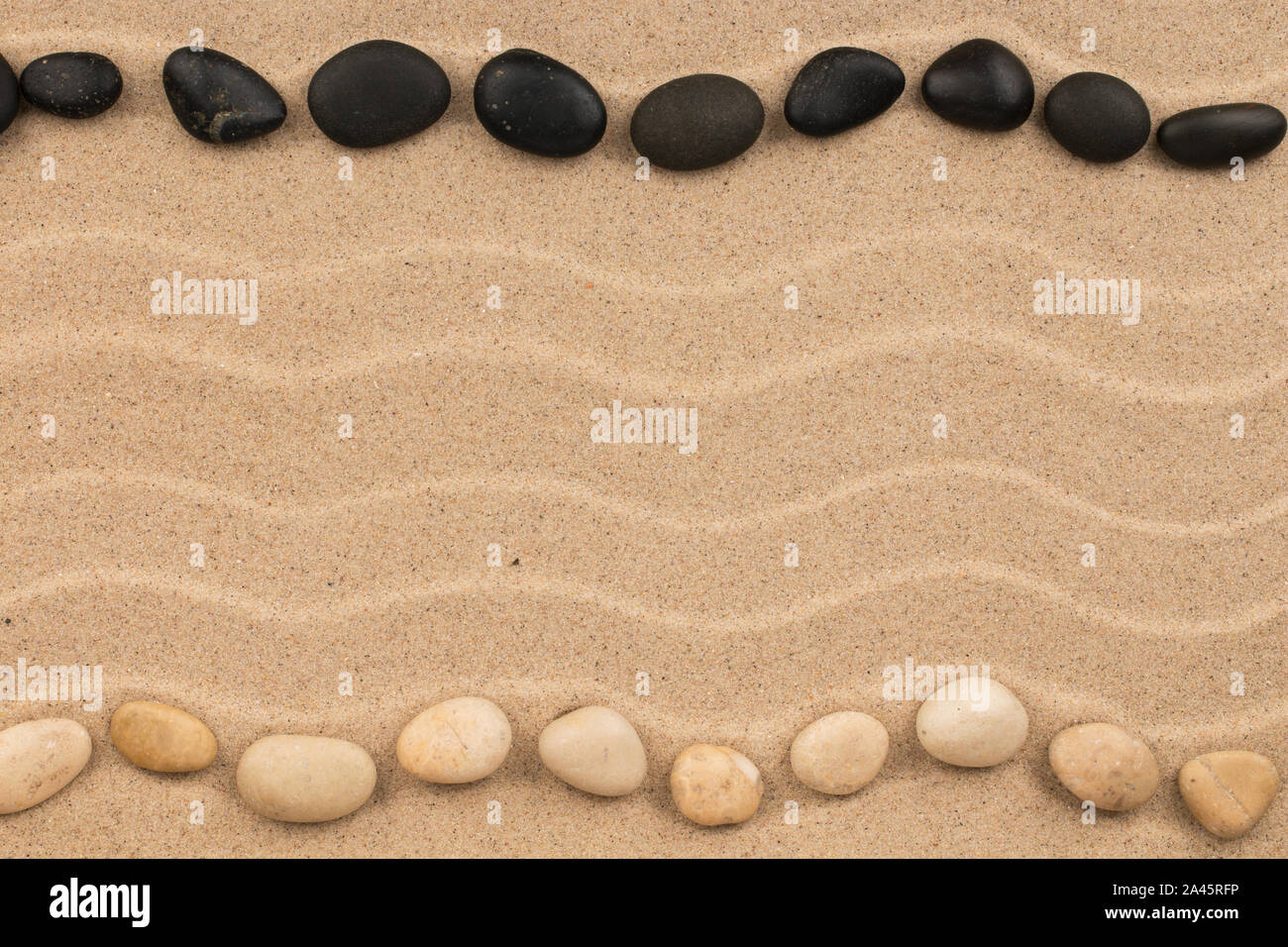 Two line made of stones lying zigzag on the dunes. Top view. Copy space ...