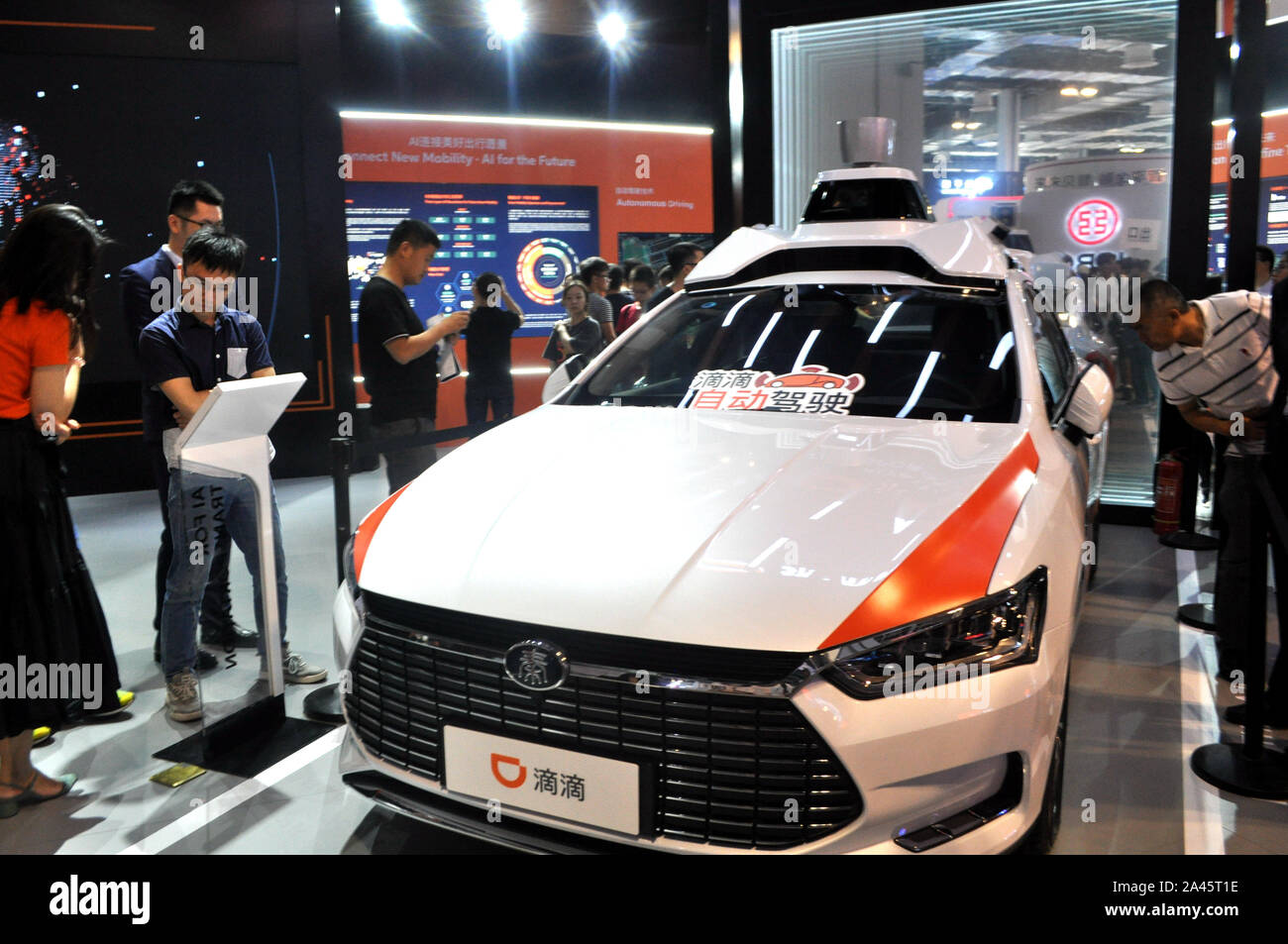 People look at "Robotaxi", the Chinese transportation company DiDi's ...