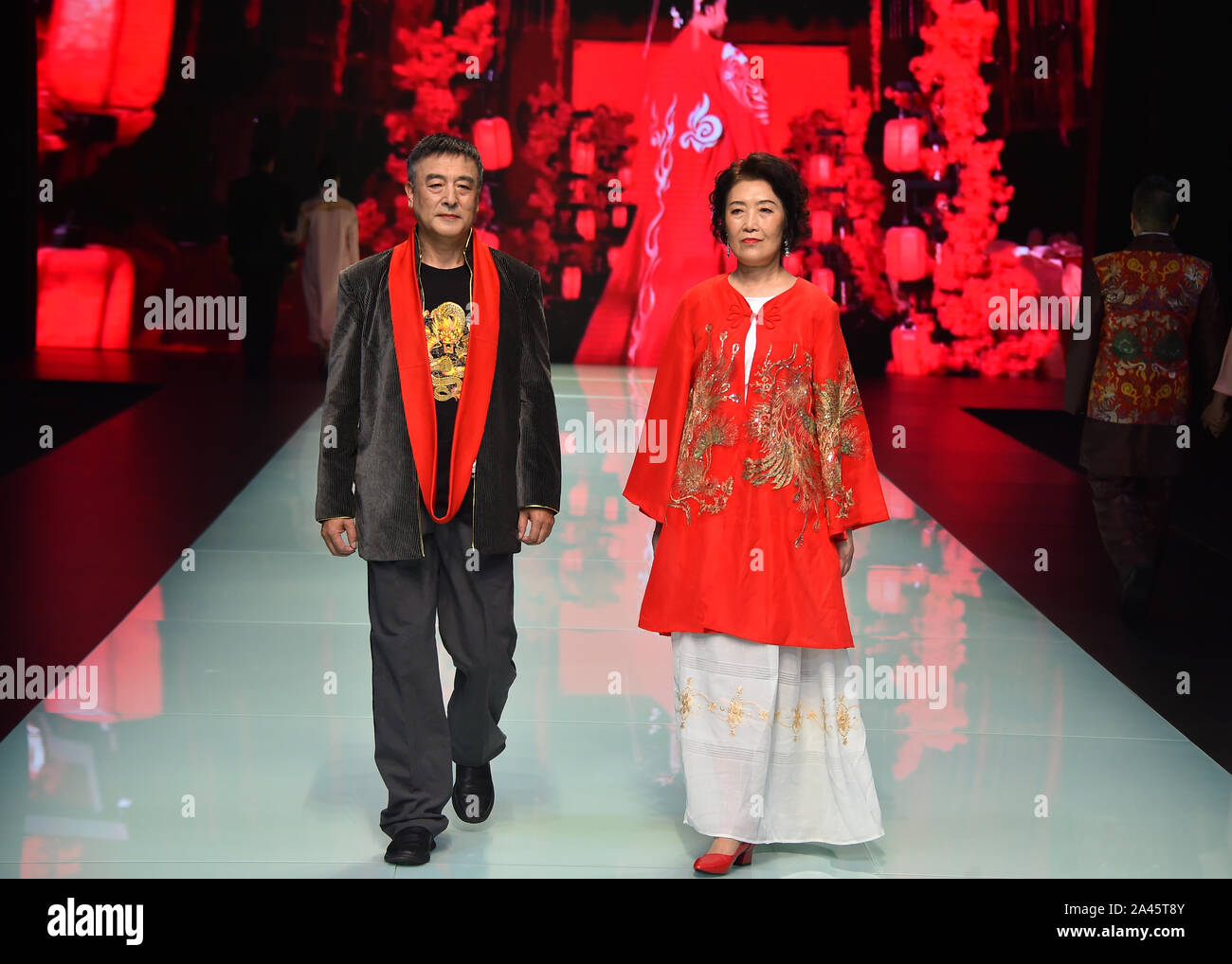 Elder models wearing traditional Chinese outfit designed by Chen Fumei ...