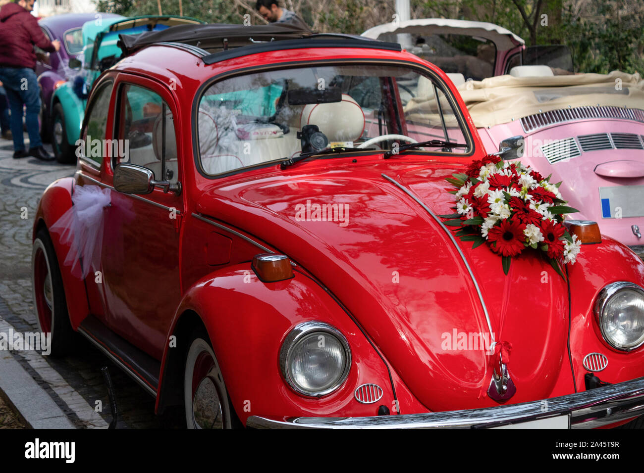 Red classic car with floral ornament on the hood Stock Photo - Alamy