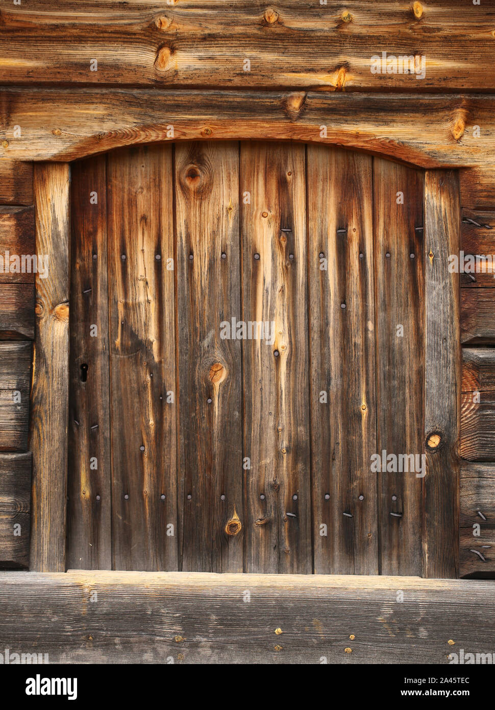 Old and rustic hatch on a log hut Stock Photo - Alamy