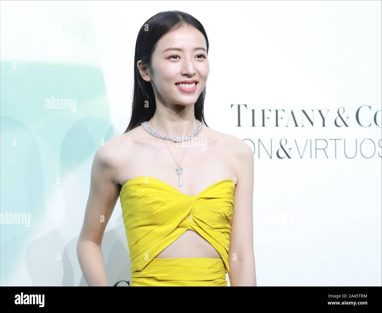Chinese actress Zhou Yutong wears a bright yellow dress attending the ...