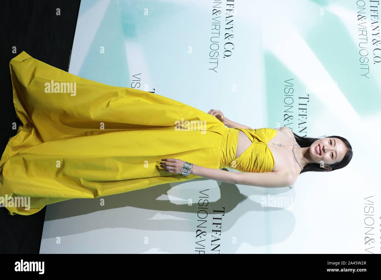 Chinese actress Zhou Yutong wears a bright yellow dress attending the ...