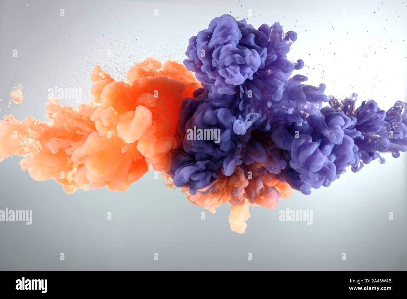 Orange and purple paint splash isolated on white background Stock Photo ...