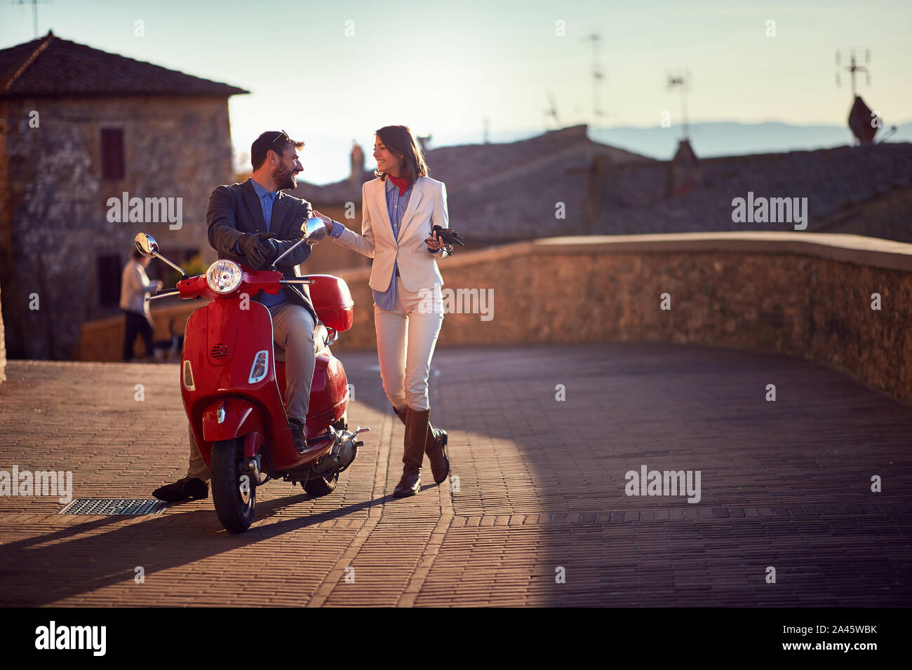 Smiling people on scooter. scooter in the city. Young people riding ...