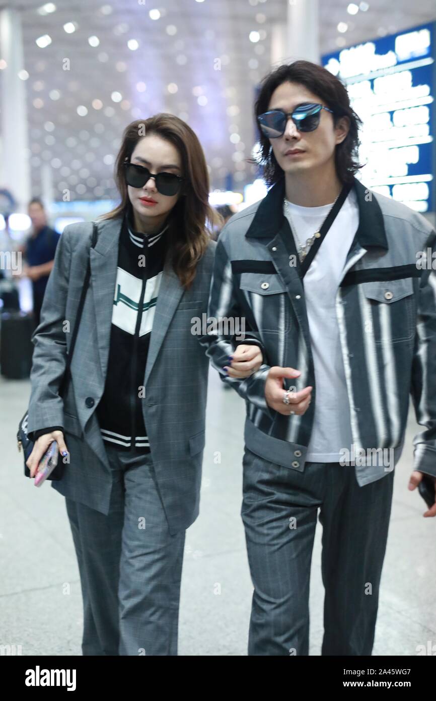 Chinese actress Qi Wei, left, and his husband Nathan Scott Lee, a ...