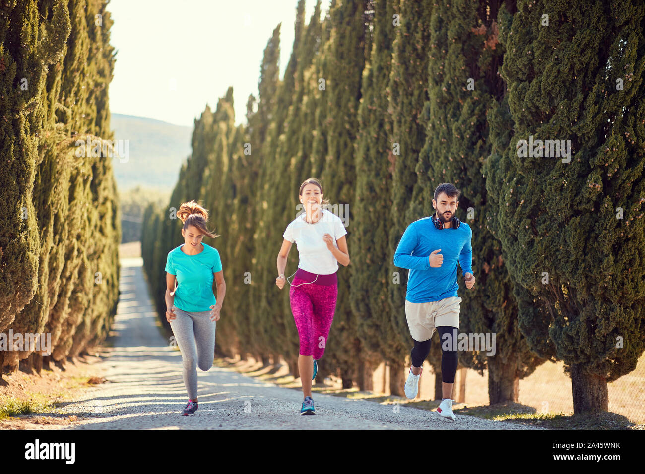 People jogging outdoors training together. healthy lifestyle Stock ...