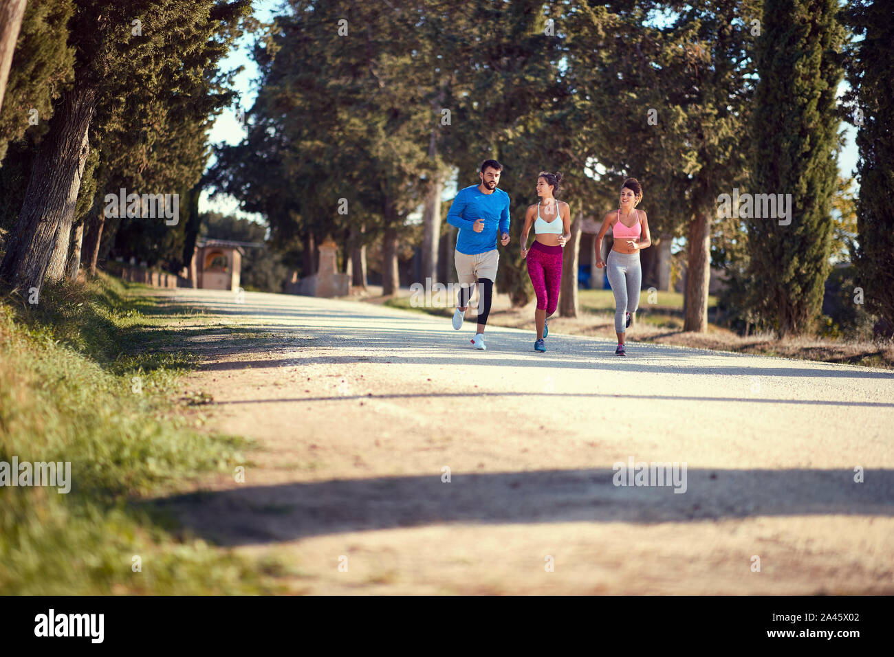 Young happy people jogging in nature. healthy lifestyle Stock Photo - Alamy