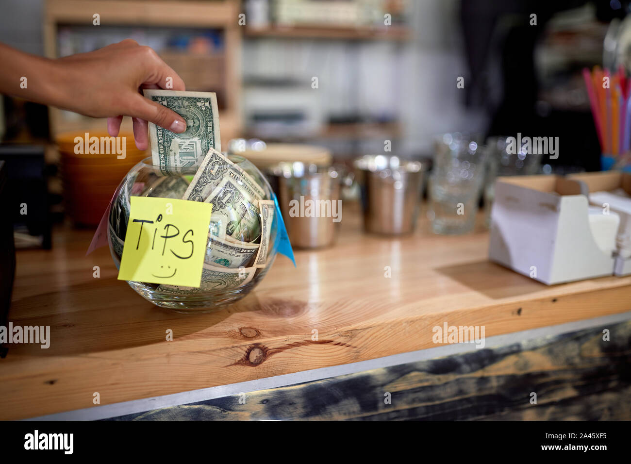 Tips - Money left for a employee in coffee shop.Coffee business concept ...