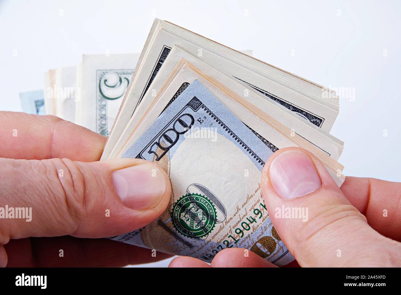 Stack of money in the hand. Man counting a money Stock Photo - Alamy