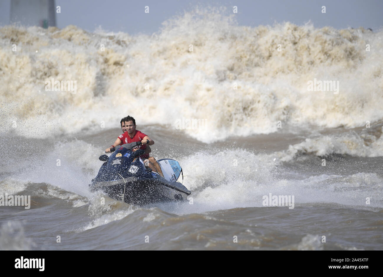 Qiantang river bore surfing hi-res stock photography and images - Alamy