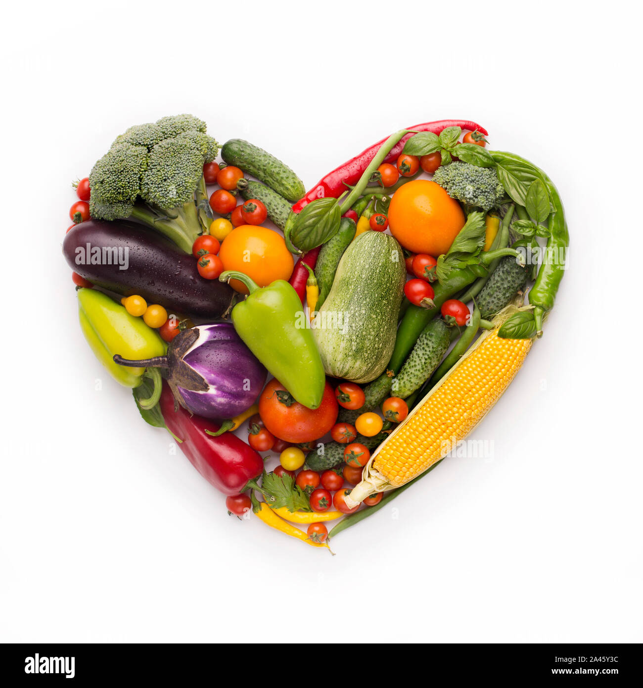 Heart shape frame of fresh vegetables on white background Stock Photo ...
