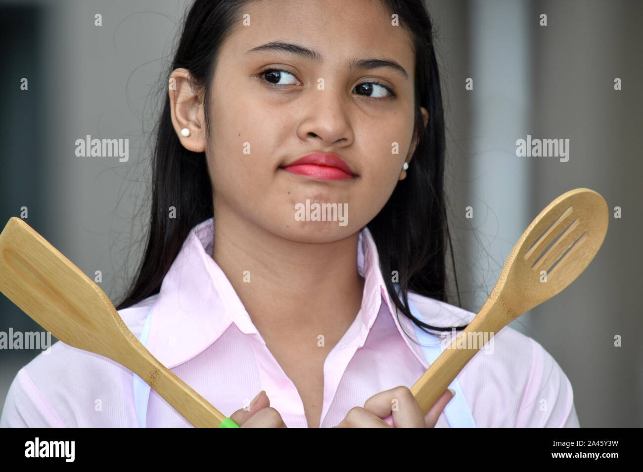 Teen With Cooking Utensils Stock Photo - Alamy