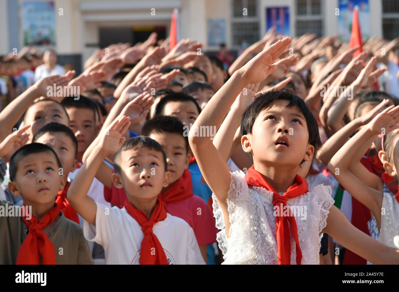 Young Chinese students wearing the red scaves of the Young Pioneers of ...