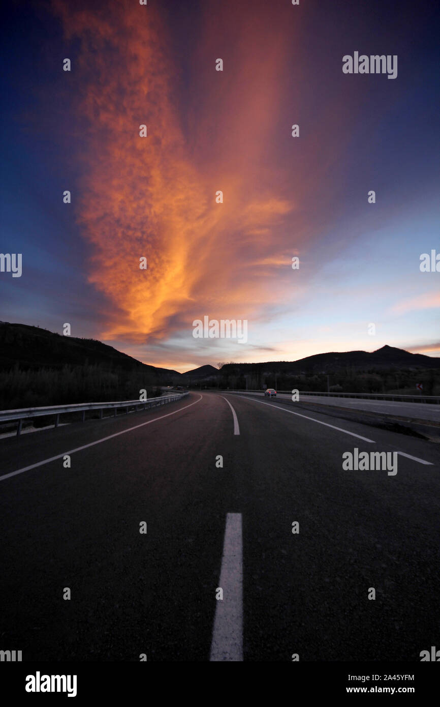 Road at sunset Stock Photo - Alamy