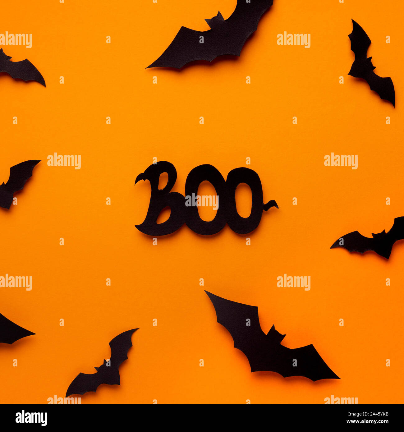 Boo bats cut of black cardboard on bright orange background Stock Photo ...