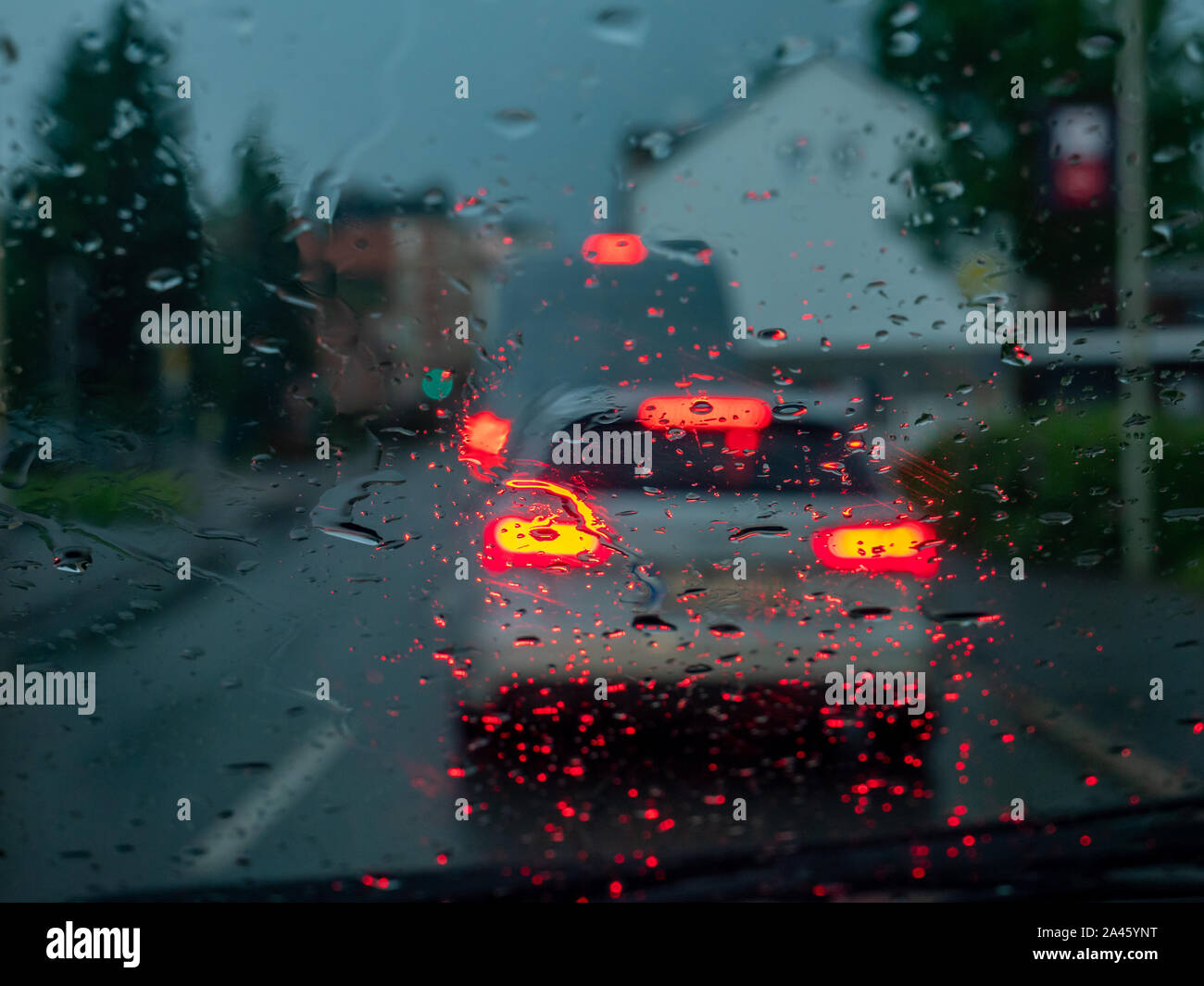 Heavy rain on the windshield with brake light Stock Photo - Alamy