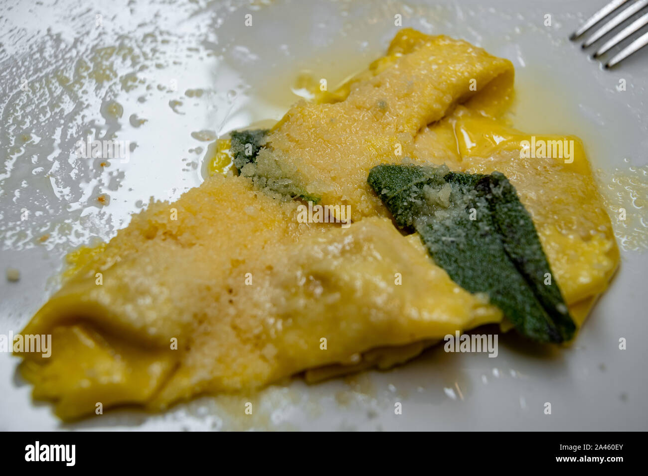 Two wineglasses, red and white, "Casoncelli",a kind of stuffed pasta ...