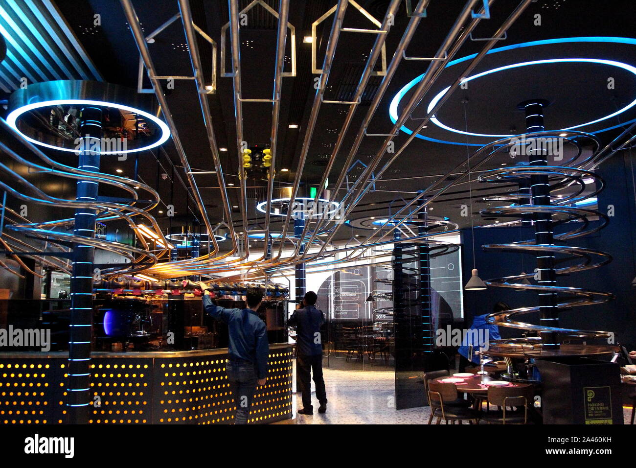 Staff work in SpaceLab, a space-themed restaurant featuring gravity ...