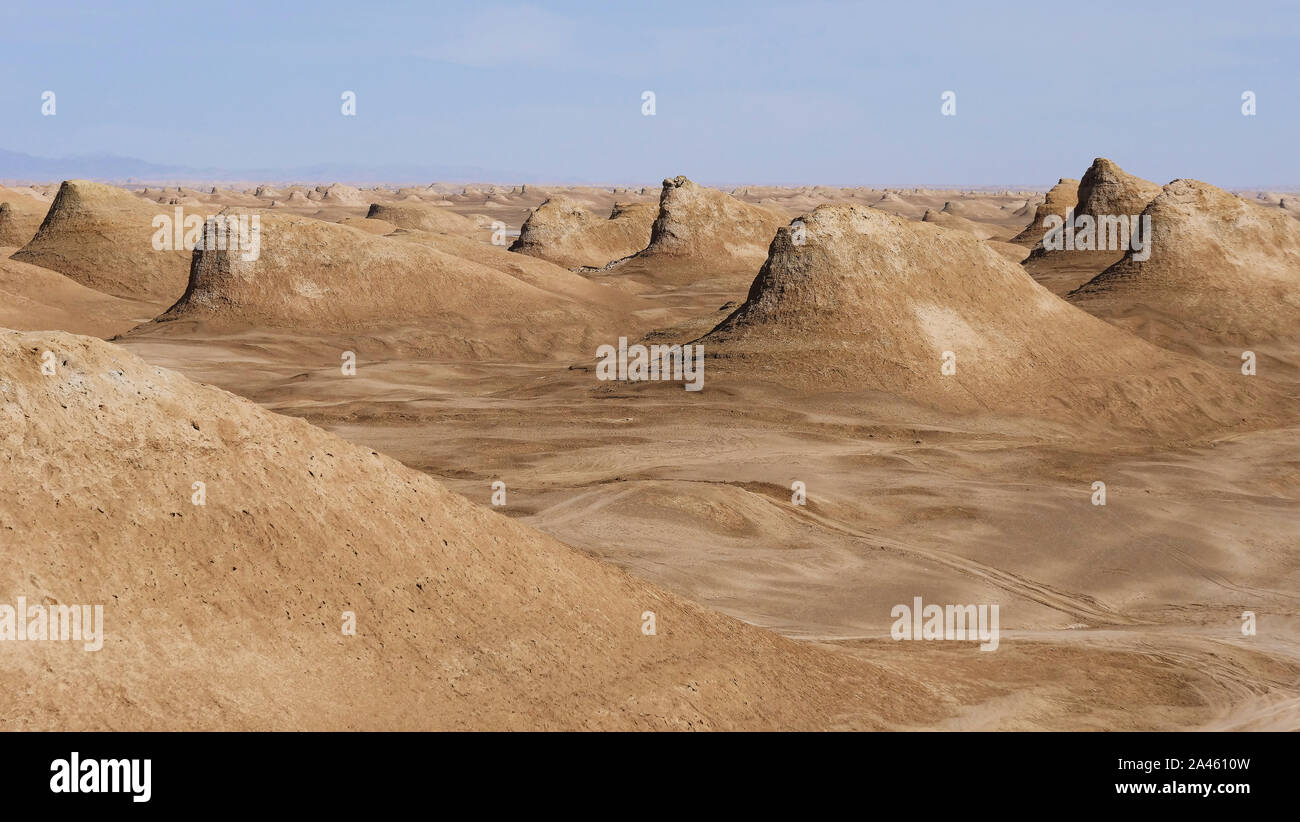 Beautiful landscape view of Yardang landform and sunny blue sky in ...