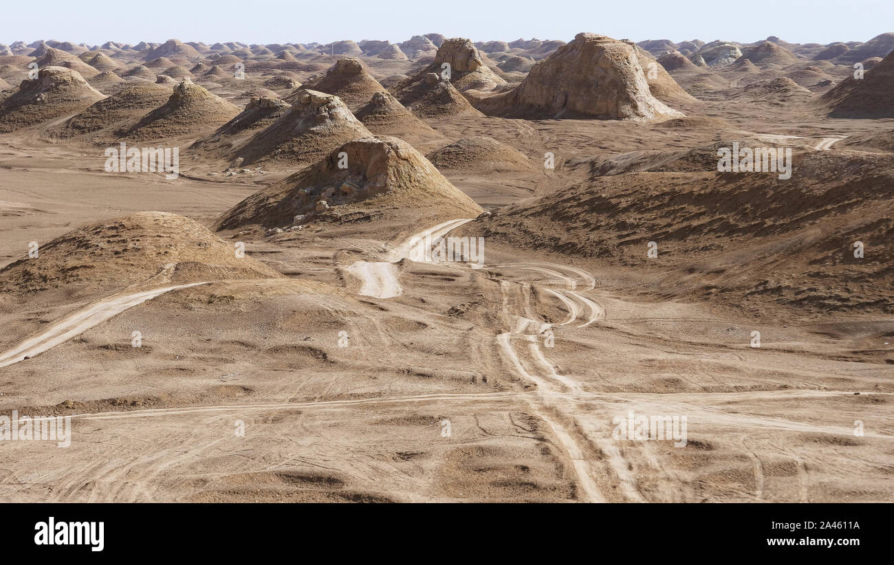 Beautiful landscape view of Yardang landform and sunny blue sky in ...
