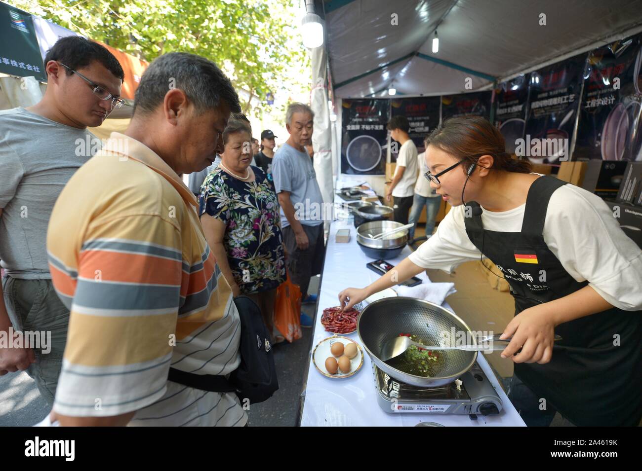 A staff introcues cooking at the 2019 German Culture Week and the 9th ...