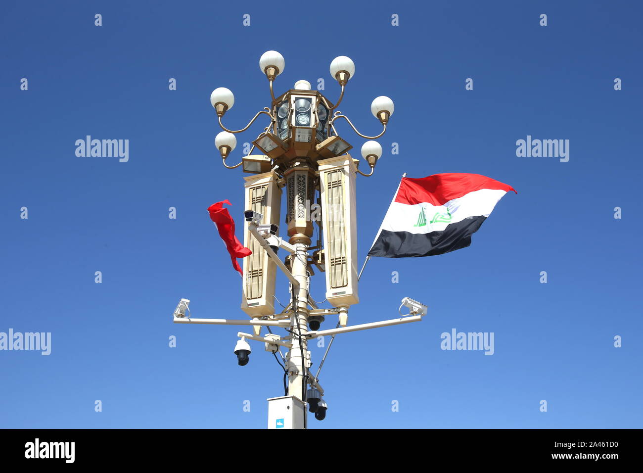The national flag of the Republic of Iraq flies outside the Forbidden ...
