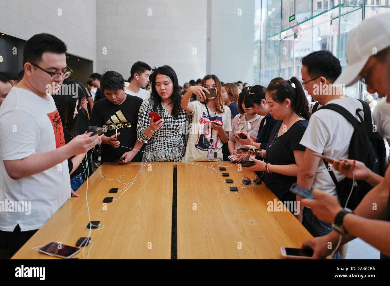 Customers try out iPhone 11 series smartphones at the East Nanjing Road ...