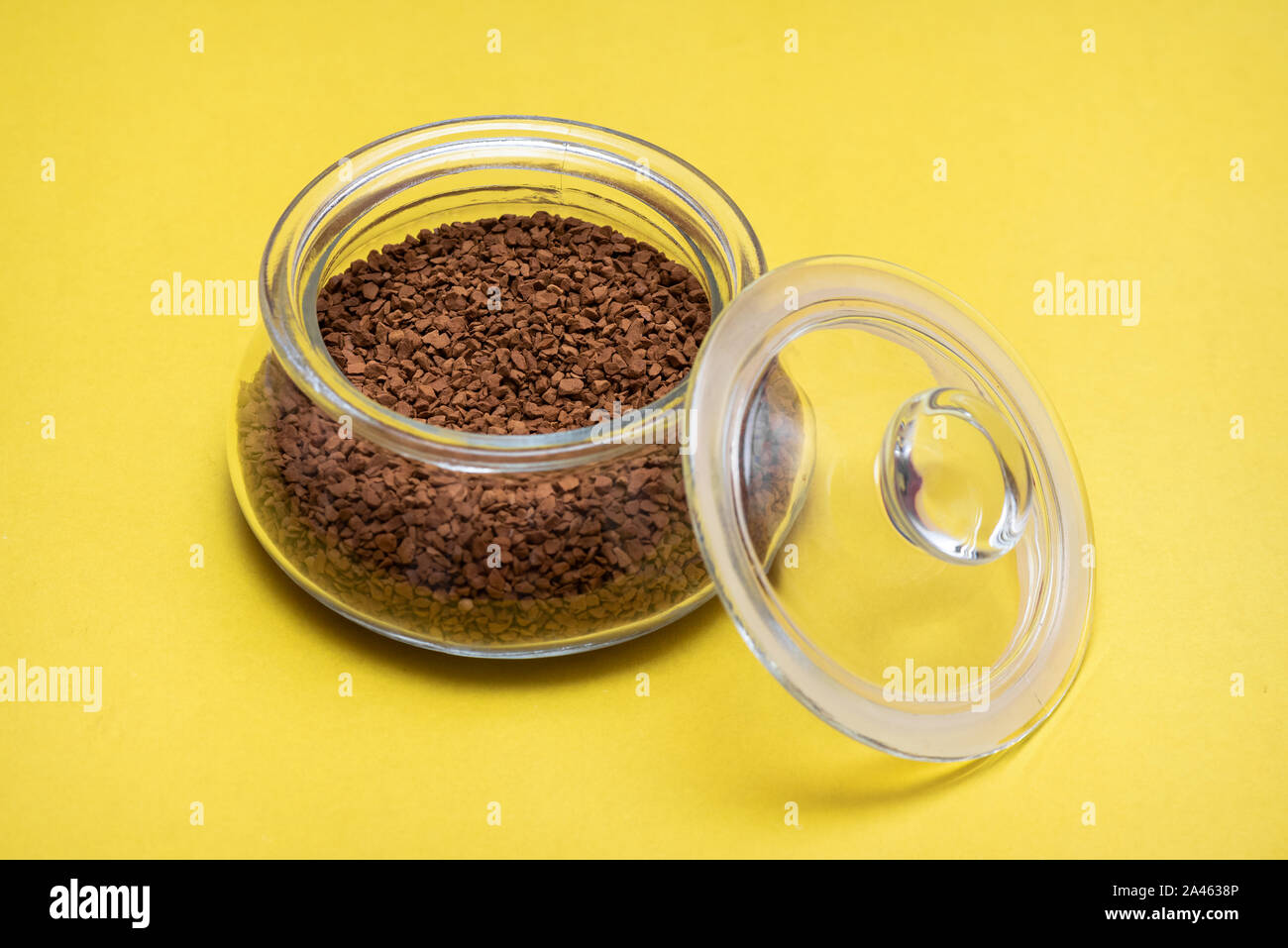 Instant coffee in a transparent jar on a yellow background Stock Photo ...