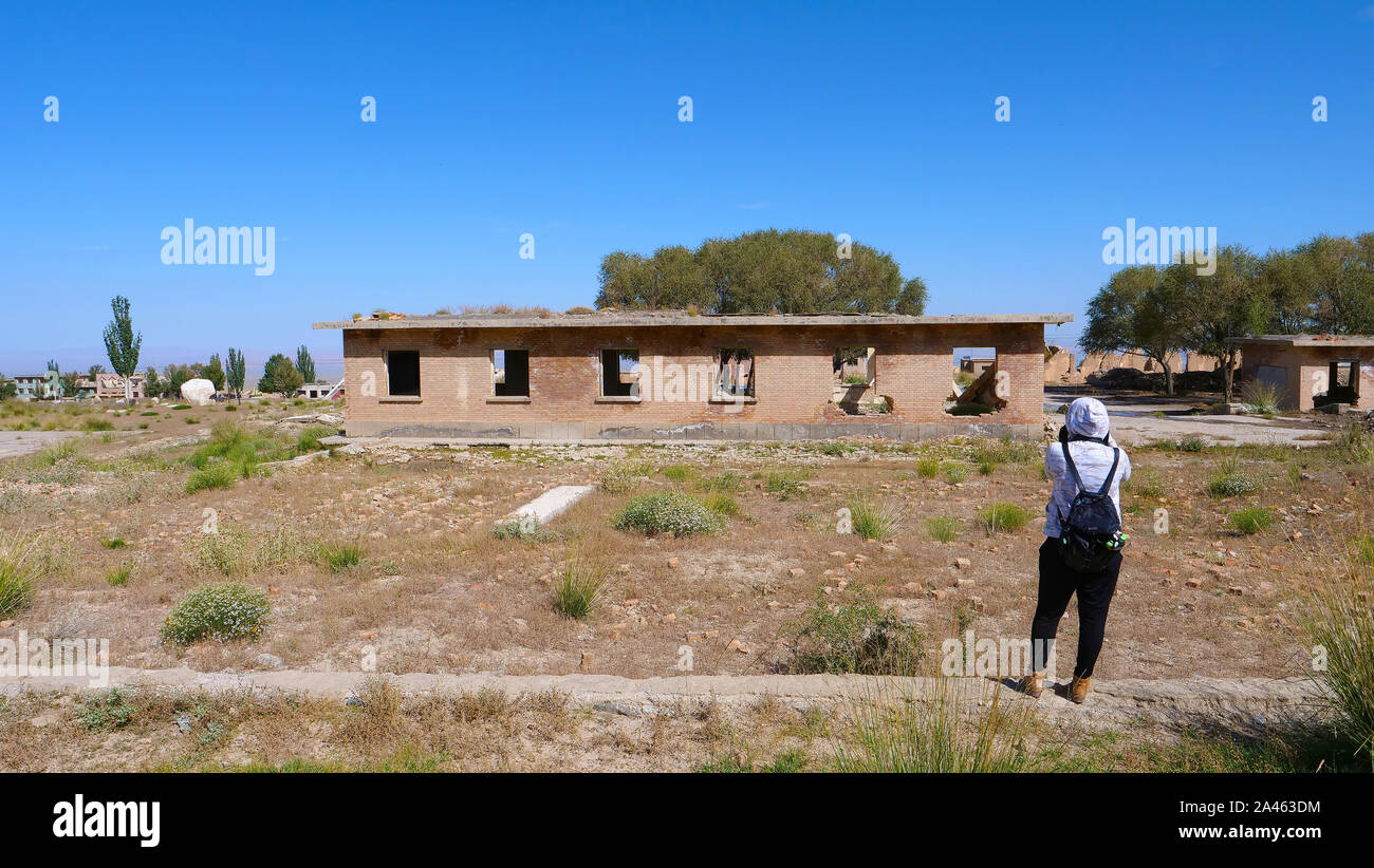Landscape view of a photographer taking picture in a desert small town ...