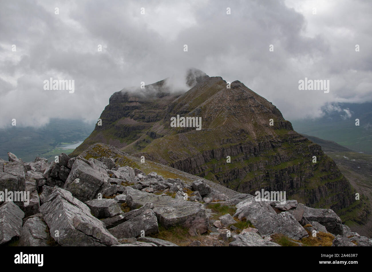 View along the ridge of Liathach, with clouds spilling over, Torridon ...