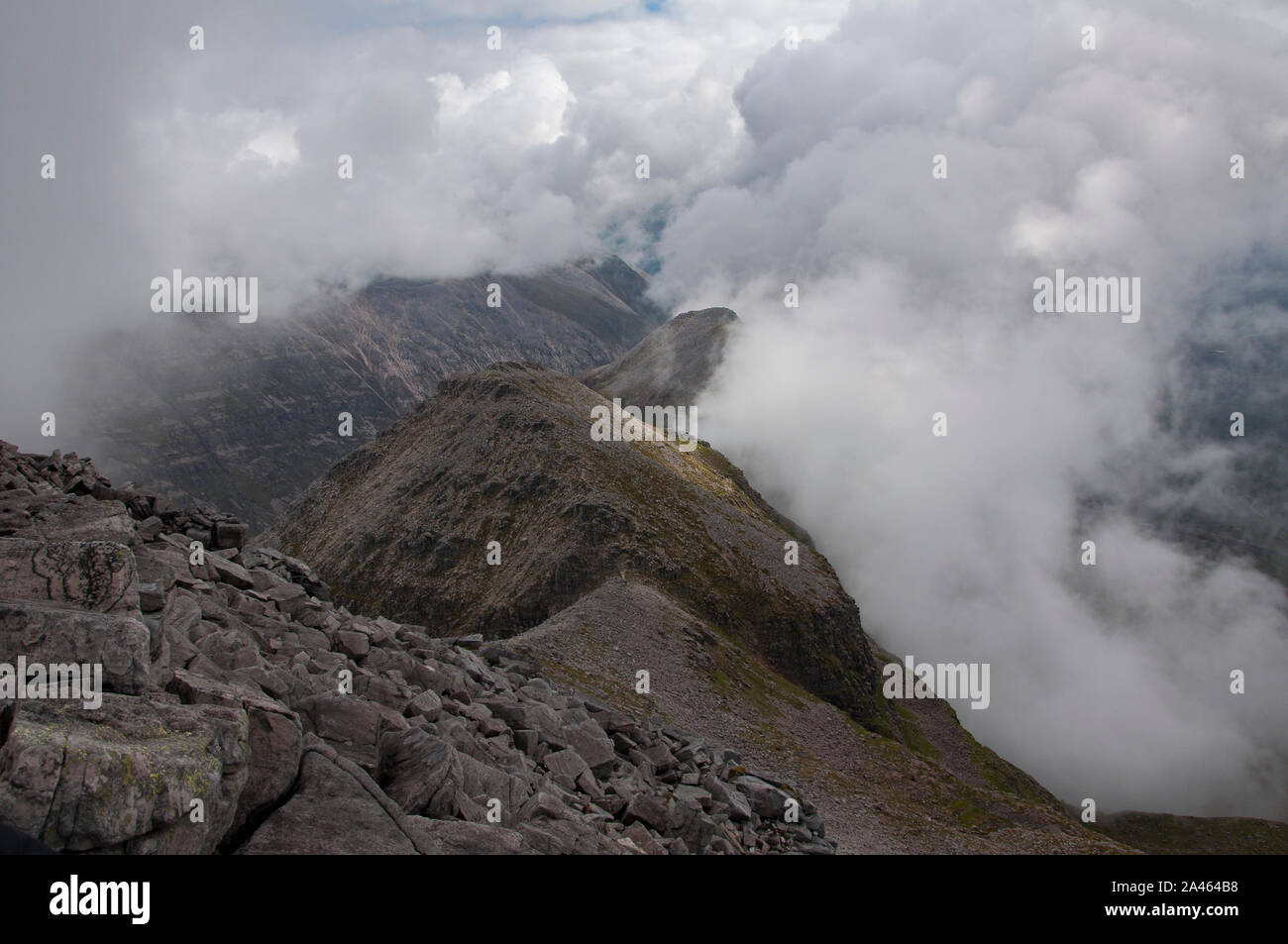 View along the ridge of Liathach, with clouds spilling over, Torridon ...