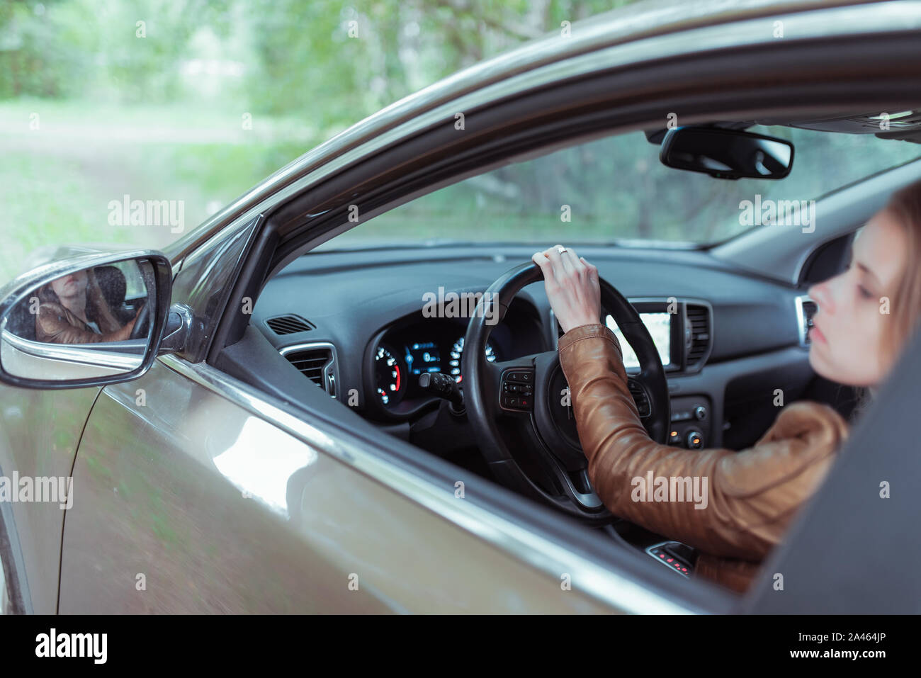 Woman driving reversing car looking hi-res stock photography and images ...